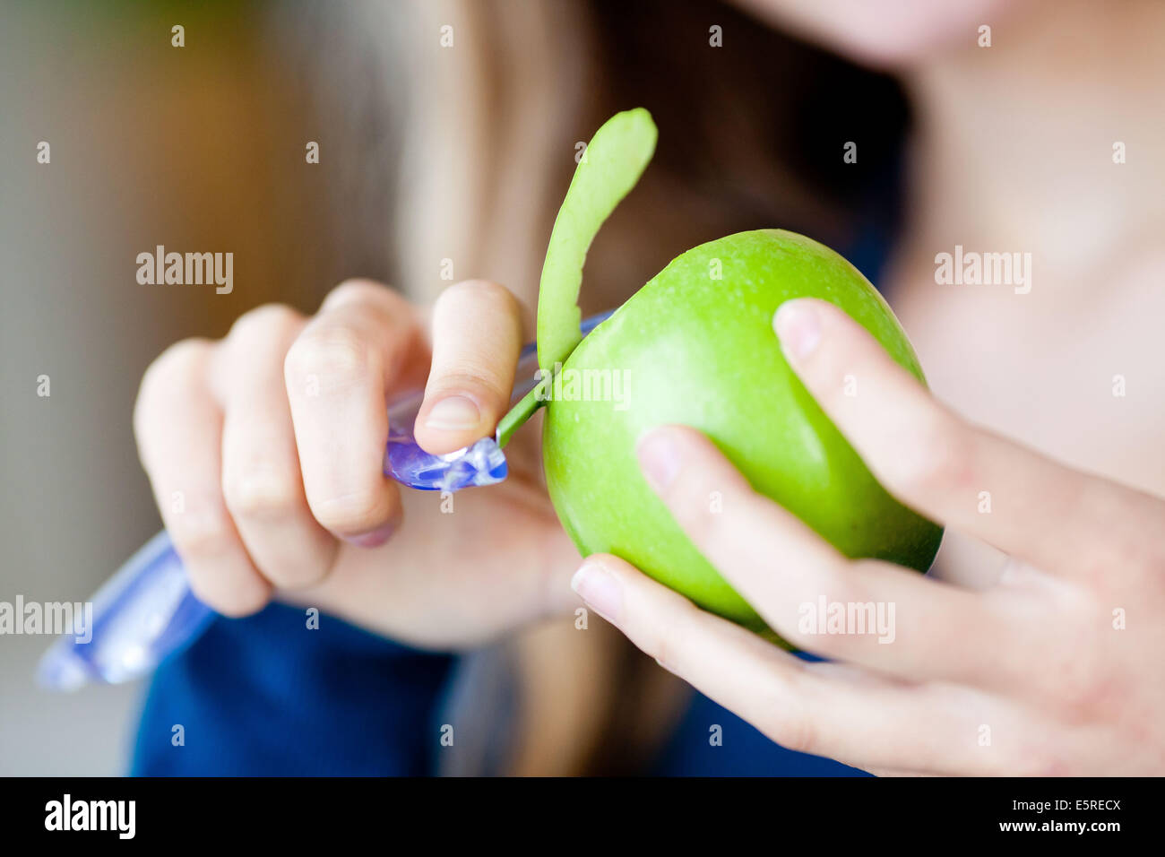 Woman peeling an apple Stock Photo - Alamy