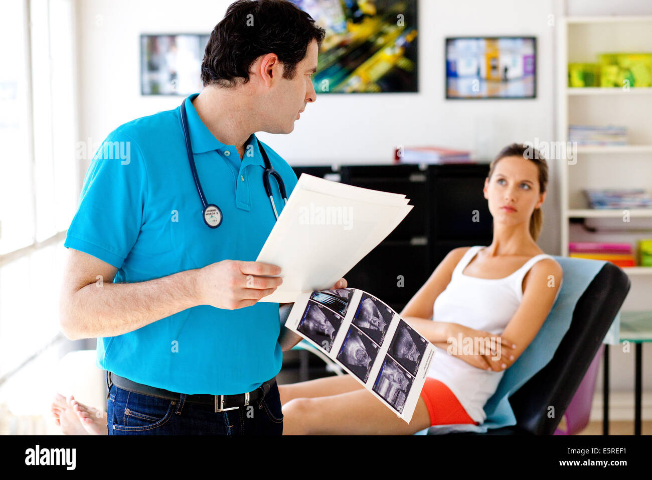General practitioner talking to a female patient Stock Photo - Alamy