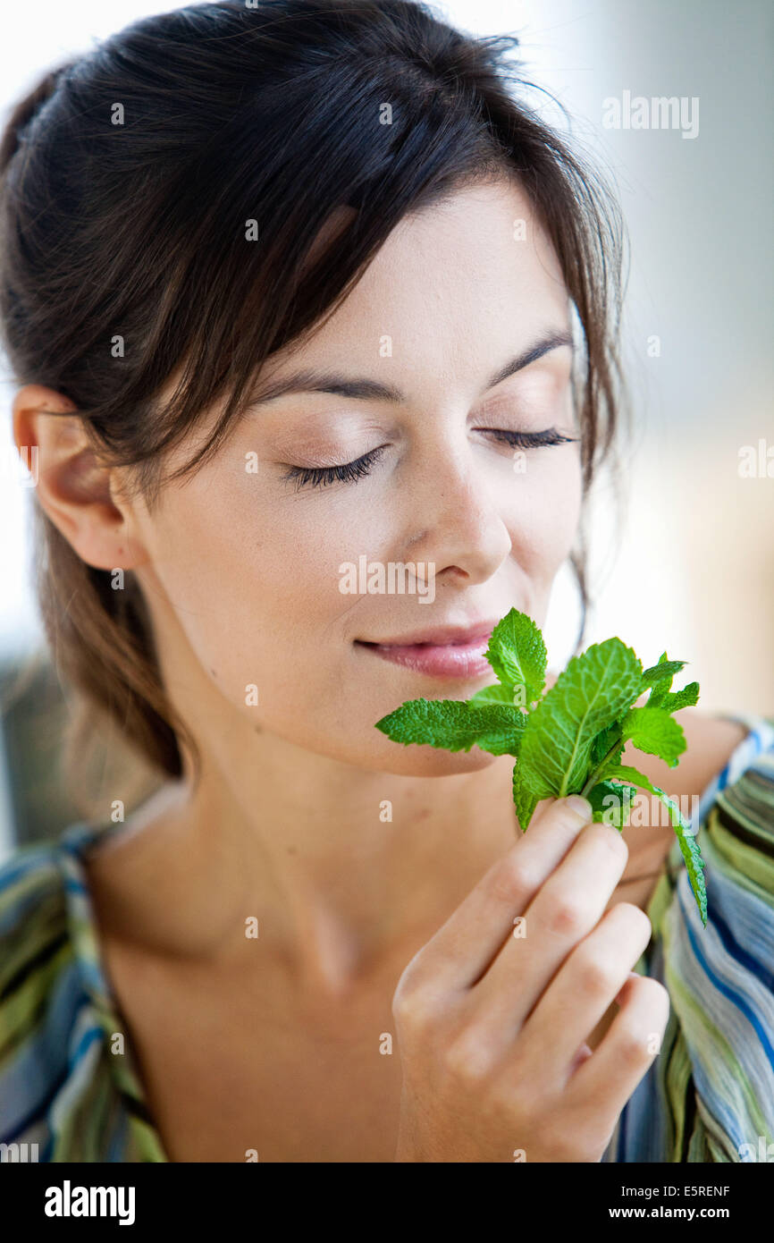Woman smelling mentha hi-res stock photography and images - Alamy