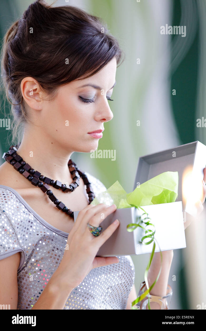 Woman receiving a gift Stock Photo - Alamy