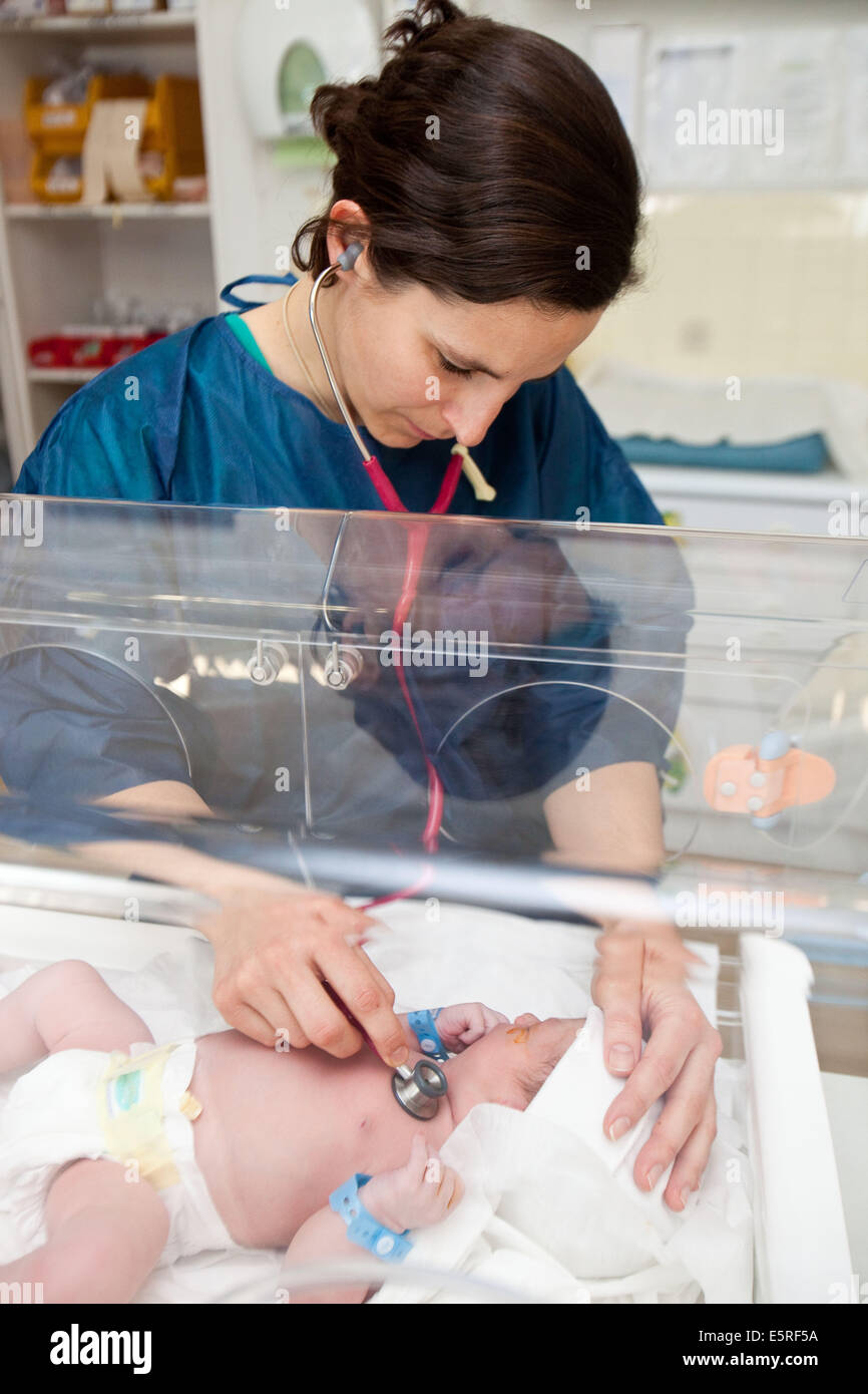 Midwife taking care of a newborn baby, Maternity department, Cochin ...