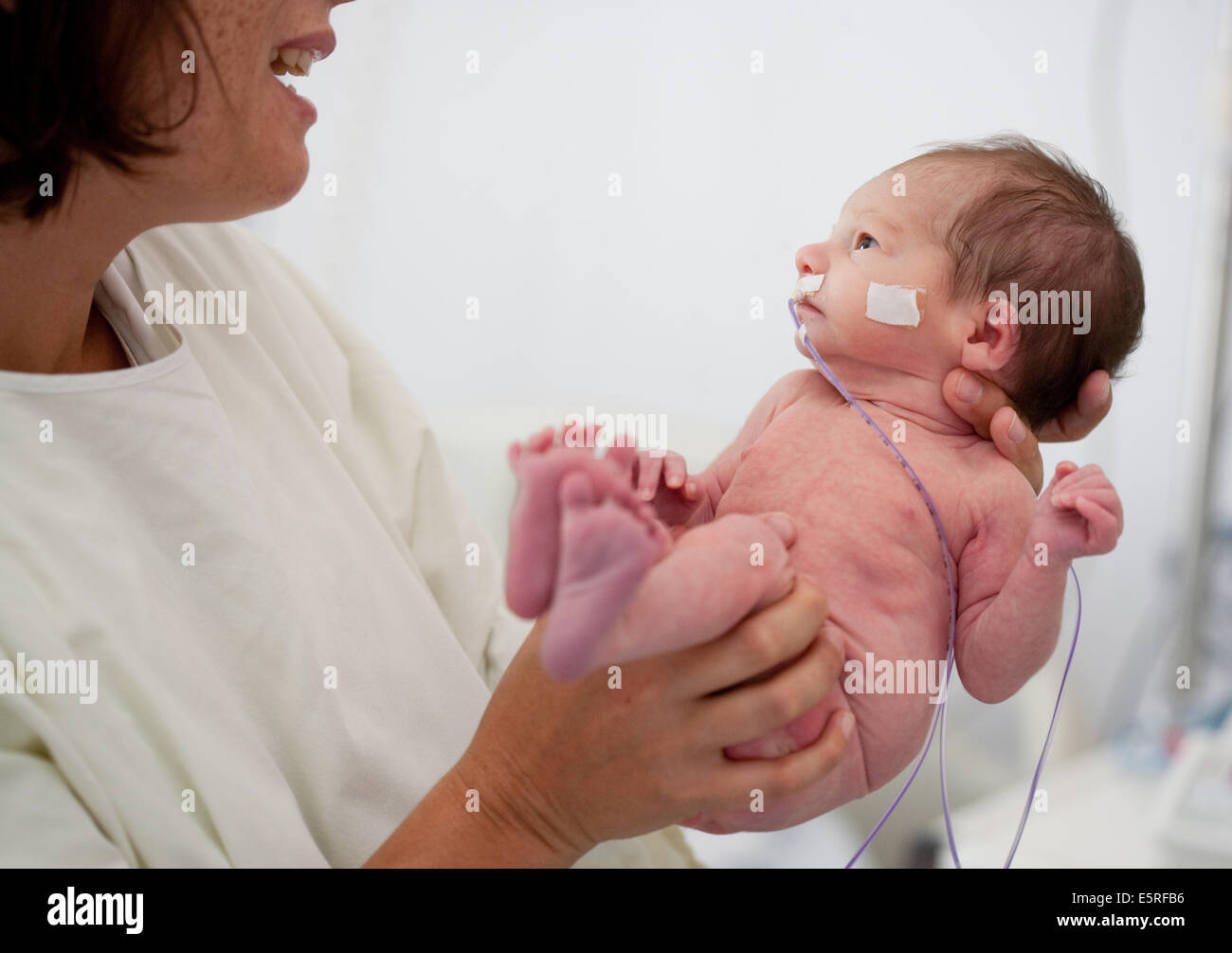 Pediatrician examining a premature newborn baby, Obstetrics and ...