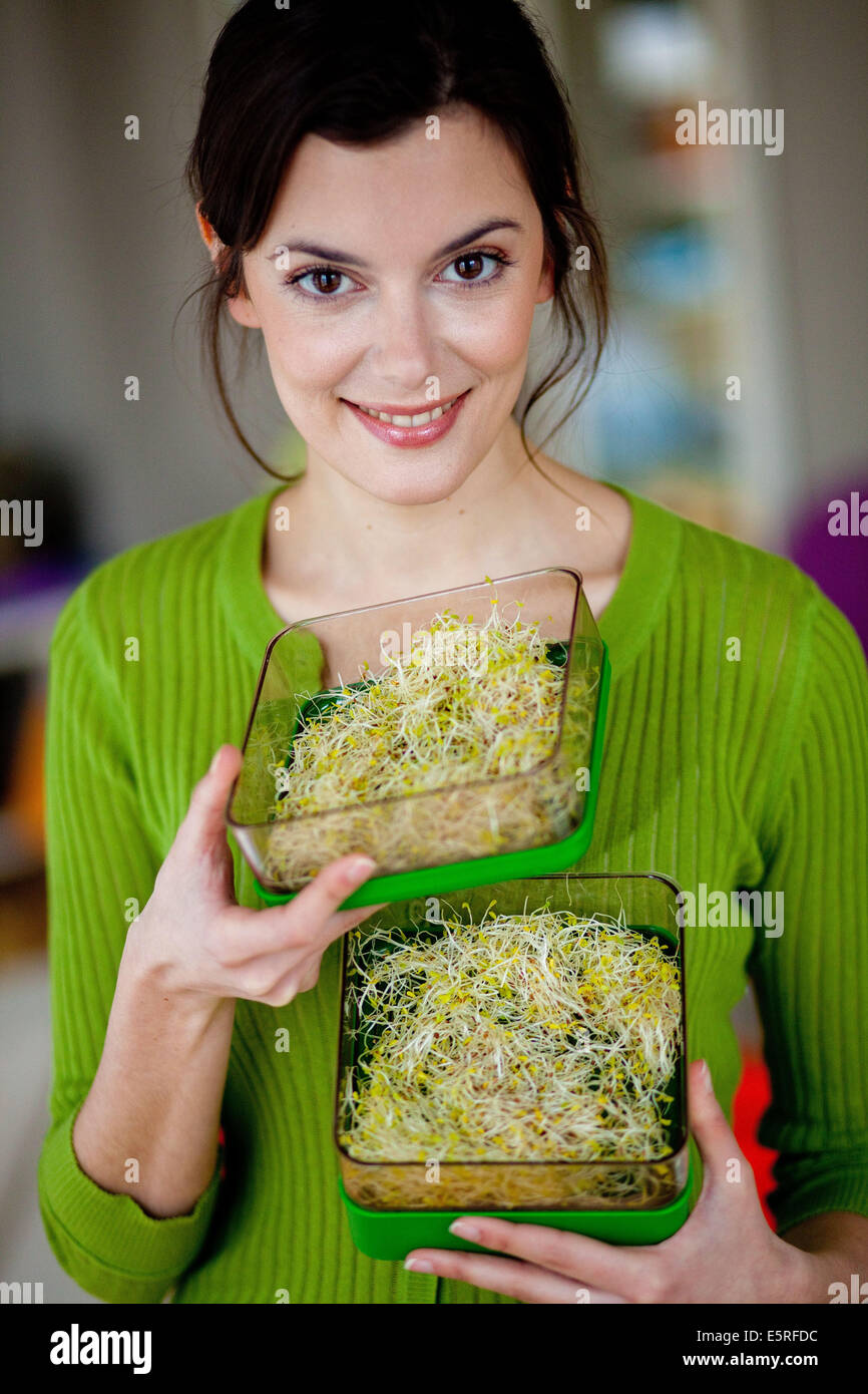 Woman eating sprouts Stock Photo - Alamy