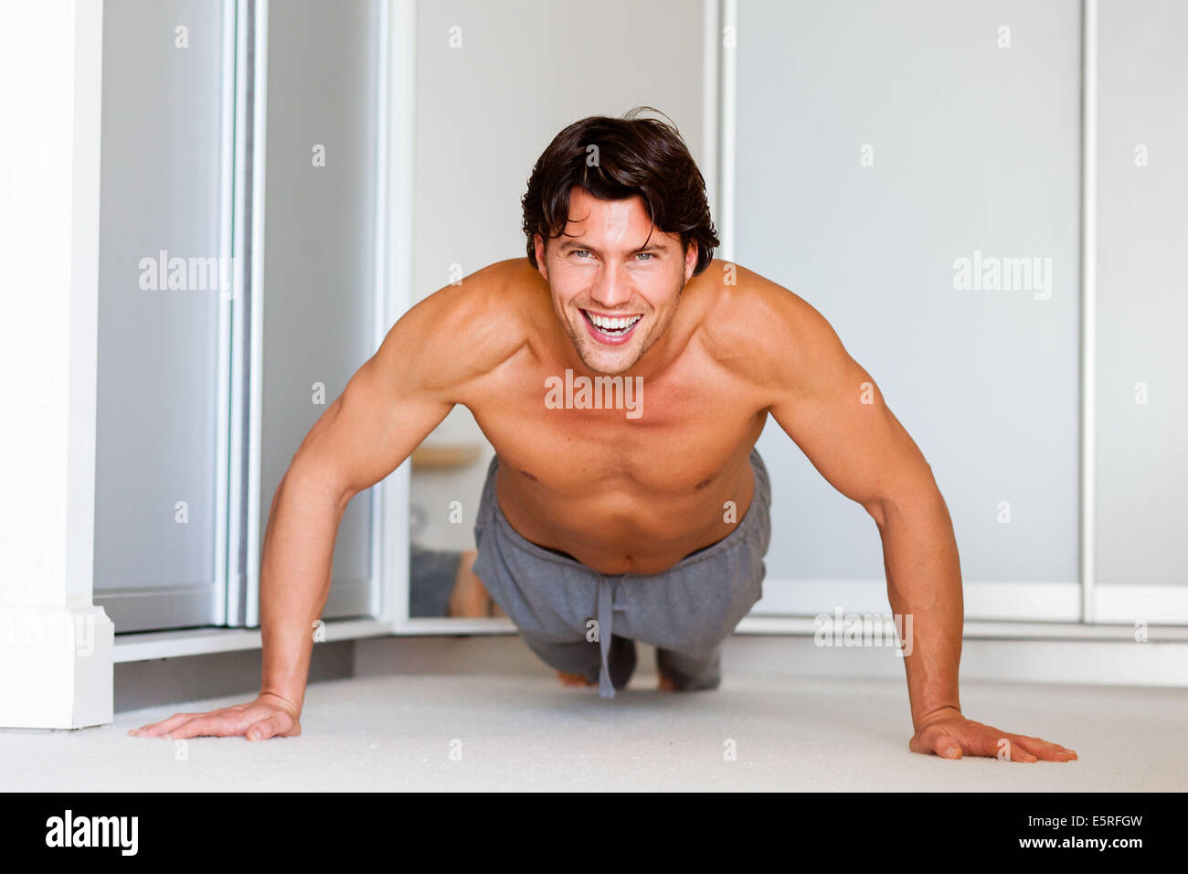 Man doing push-ups Stock Photo - Alamy