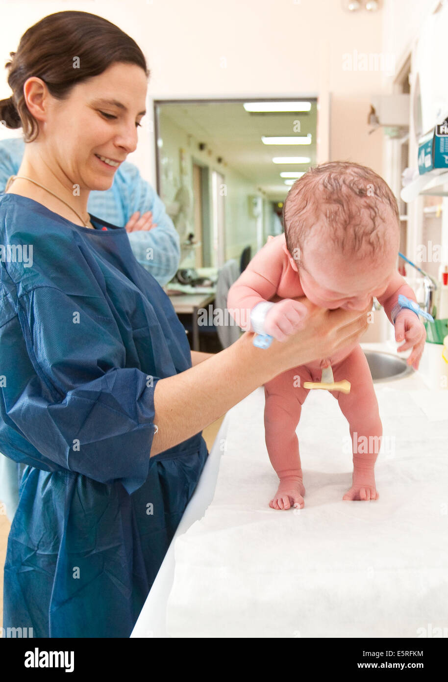 Midwife taking care of a newborn baby, Maternity department, Cochin ...