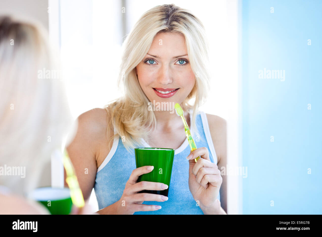 Woman brushing her teeth Stock Photo - Alamy