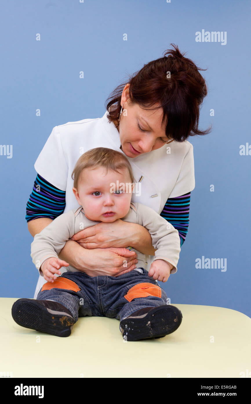 Physical Therapist performing respiratory physiotherapy on baby Stock ...
