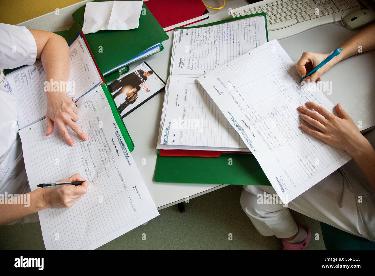 Nurses filling a patient medical records, Palliative care department ...