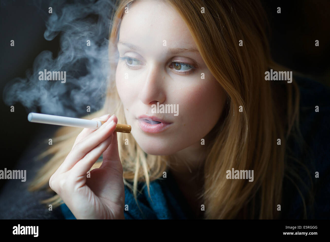 Woman smoking electronic cigarette Stock Photo - Alamy