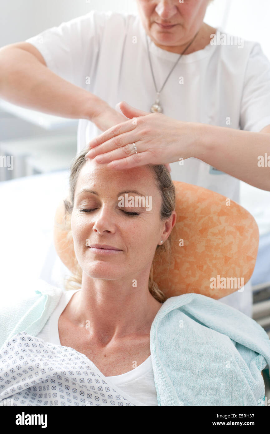 Comfort care and well-being made by an auxiliary nurse trained to feel ...