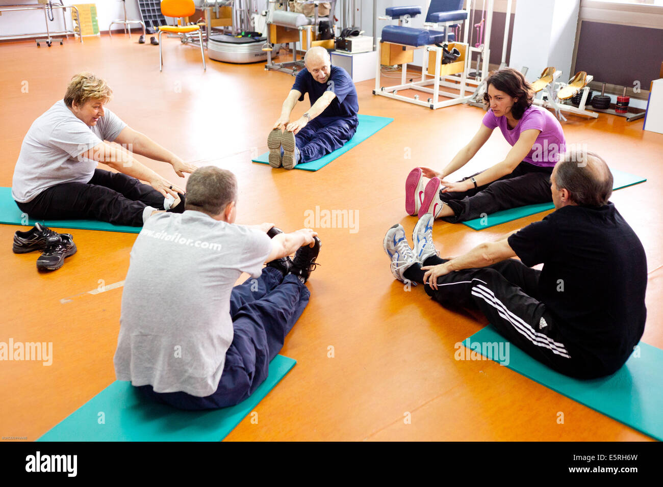 Patients doing heart rehabilitation training following a myocardial ...
