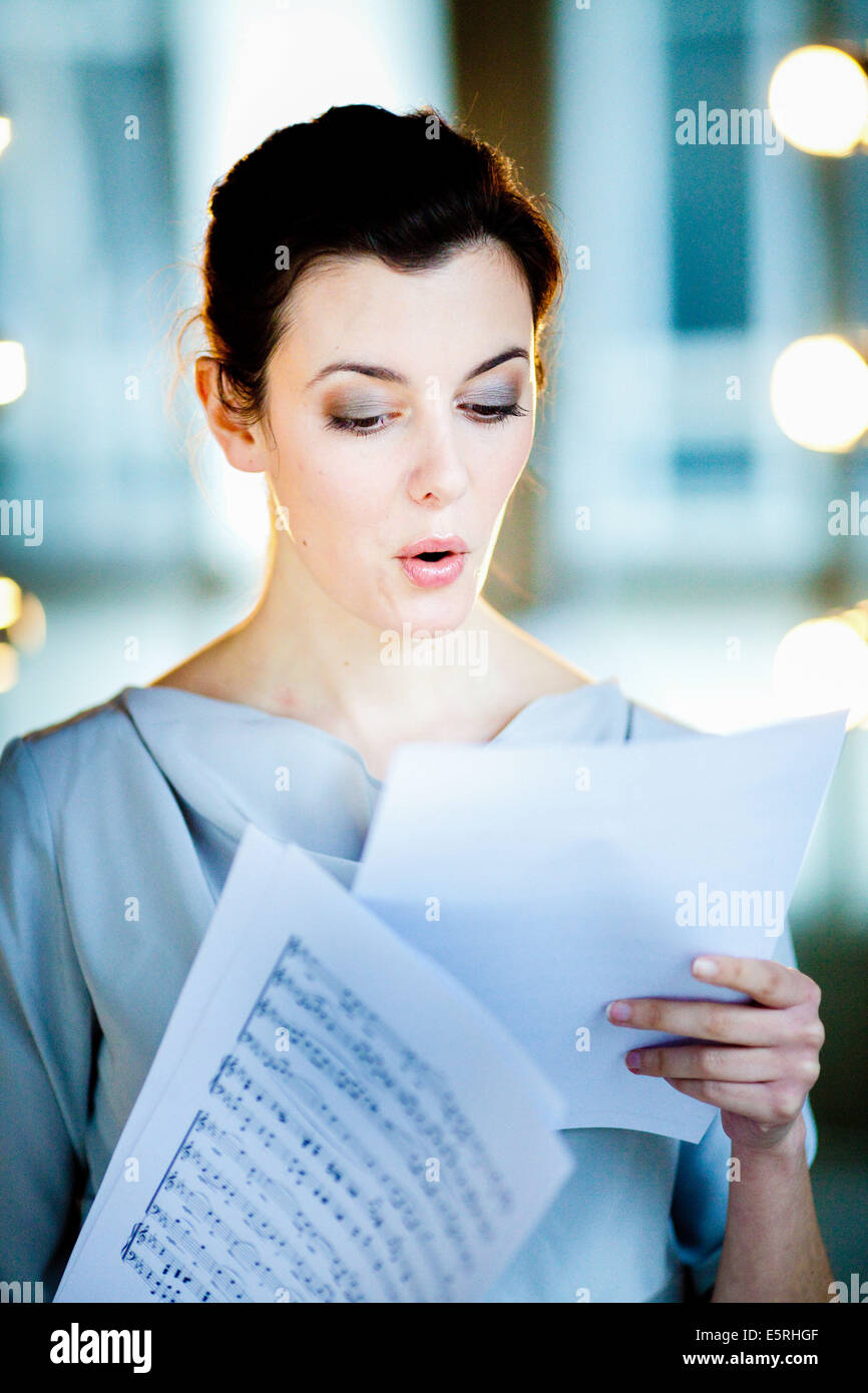 Woman practising singing Stock Photo - Alamy