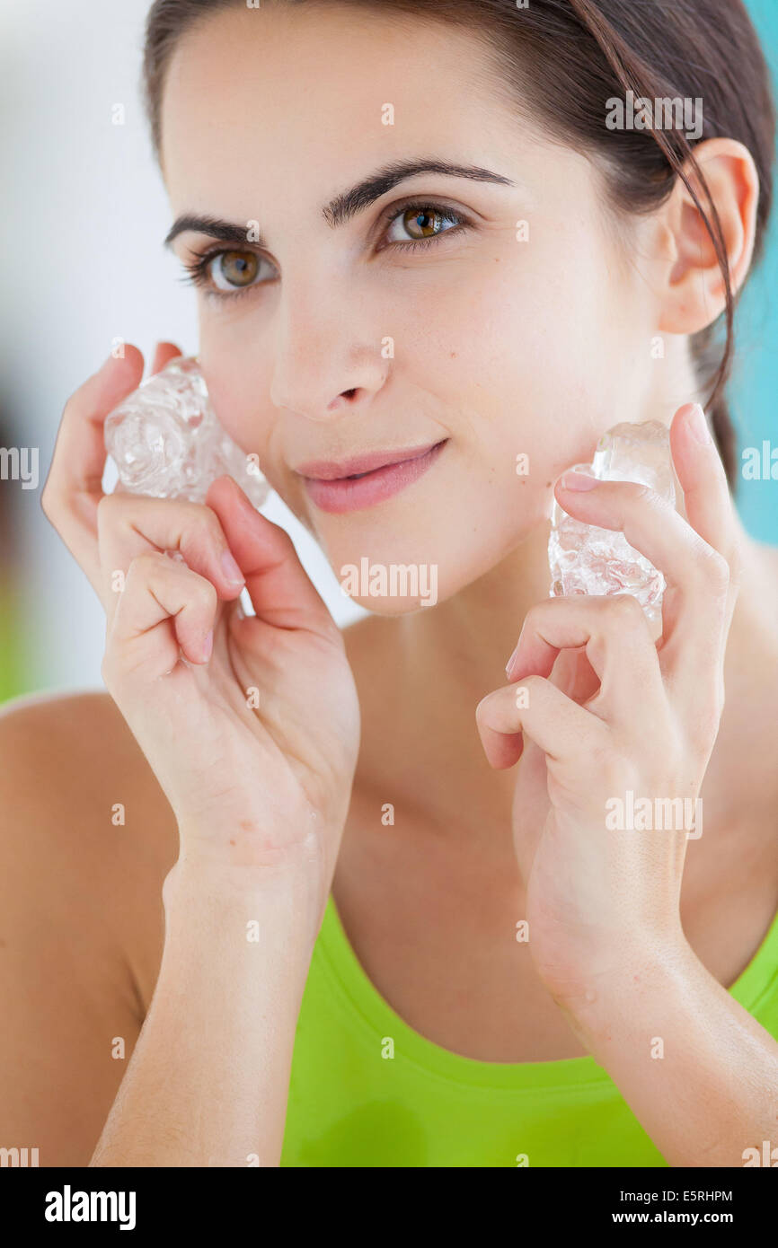 Woman face ice cube hi-res stock photography and images - Alamy
