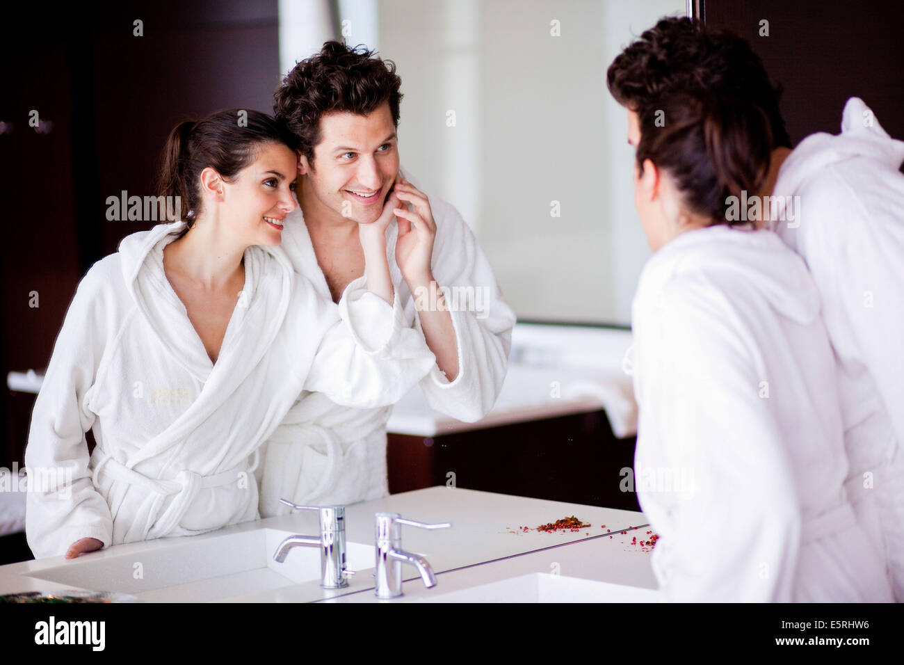 Couple checking her face in the mirror Stock Photo - Alamy