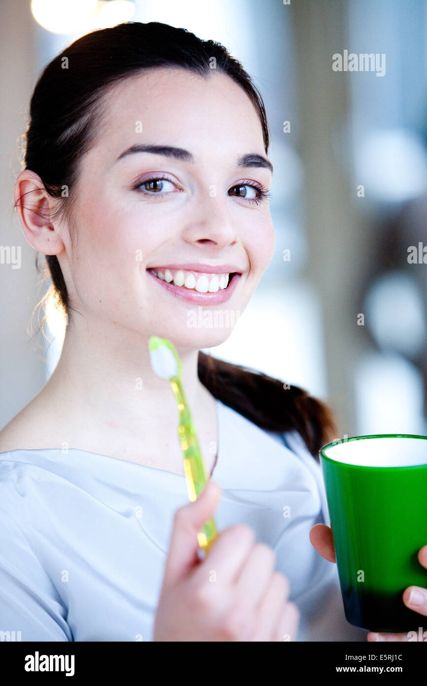 Woman brushing her teeth Stock Photo - Alamy