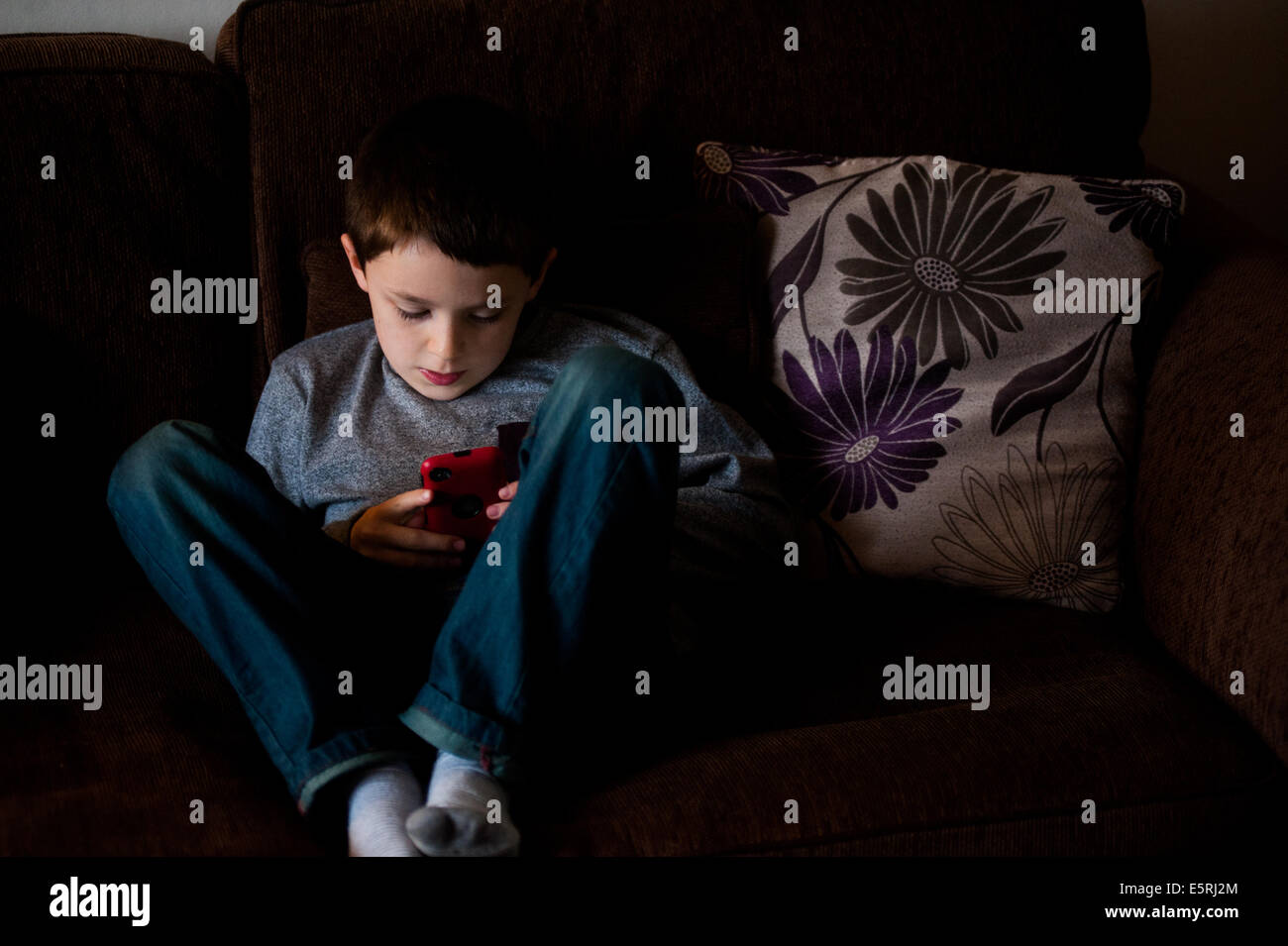 boy playing game on mobile phone Stock Photo - Alamy