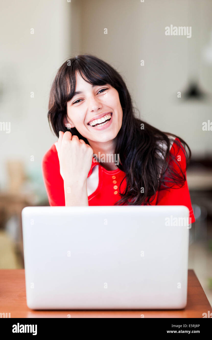 Woman using a laptop Stock Photo - Alamy
