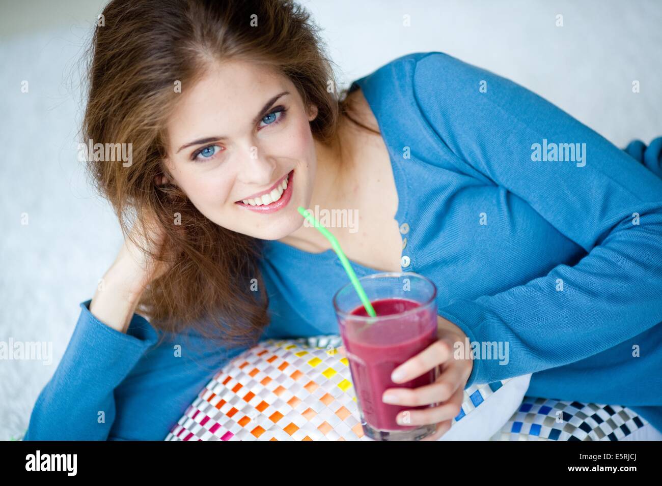 Woman drinking smoothie Stock Photo - Alamy