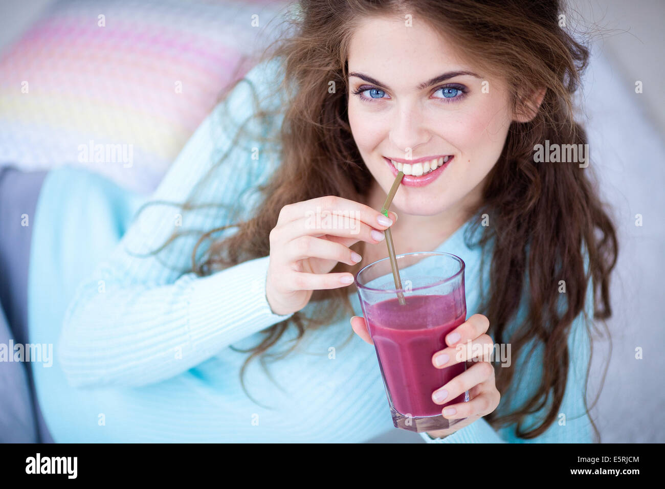 Woman drinking smoothie Stock Photo - Alamy