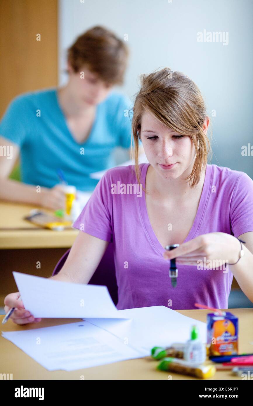 Teenagers in a classroom Stock Photo - Alamy