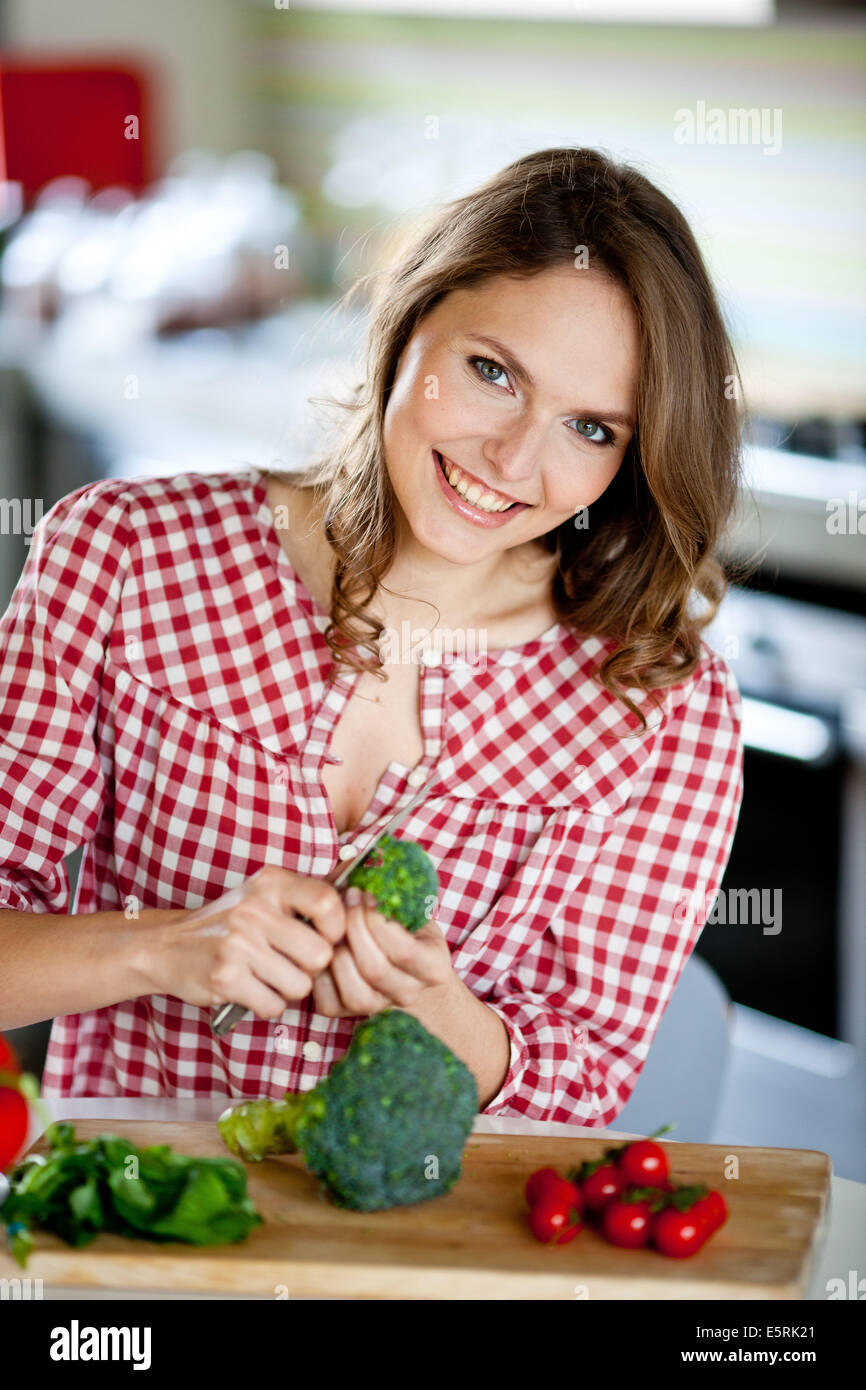 Woman cooking in kitchen Stock Photo - Alamy