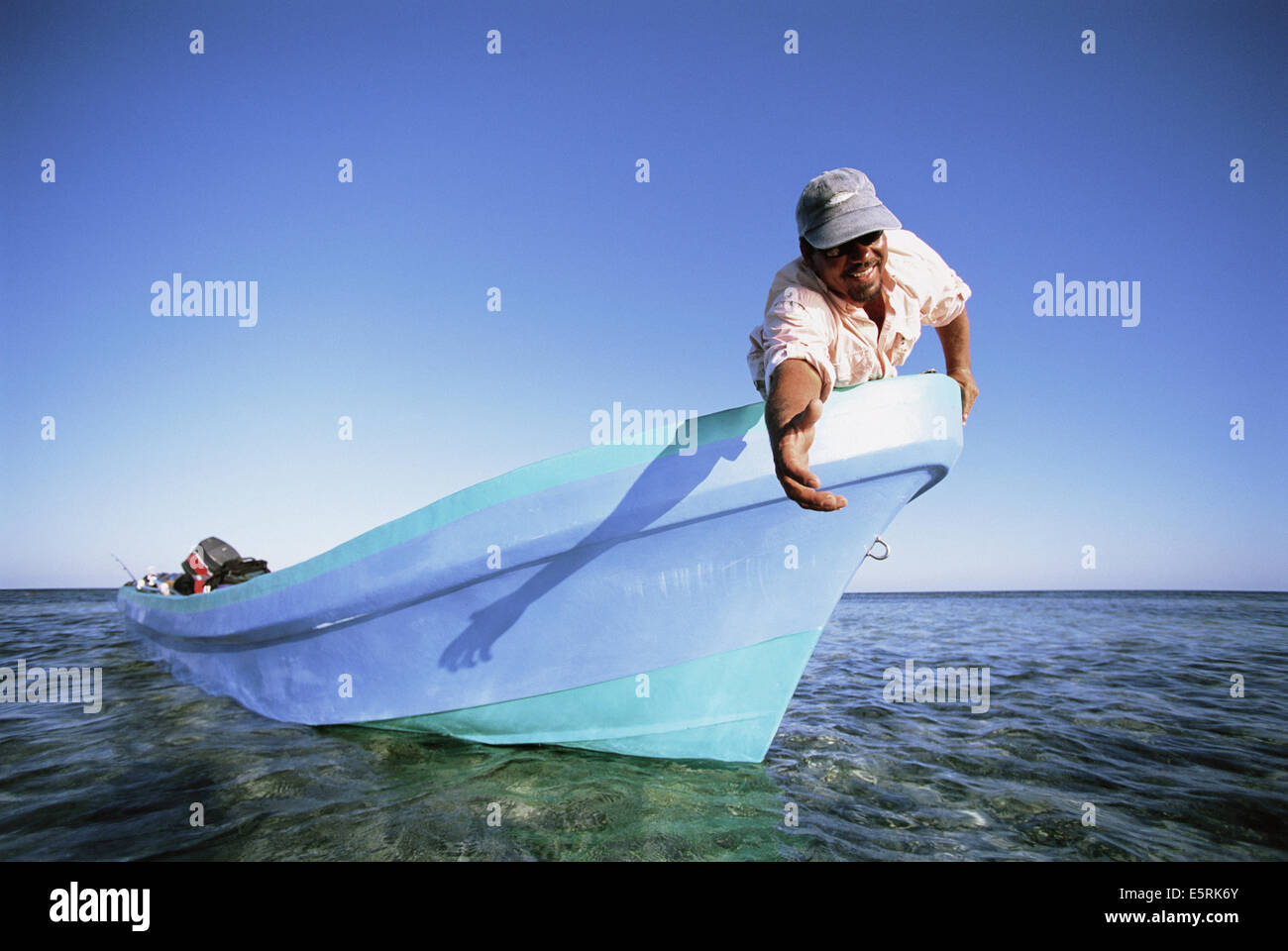 Man reaching from boat Stock Photo - Alamy