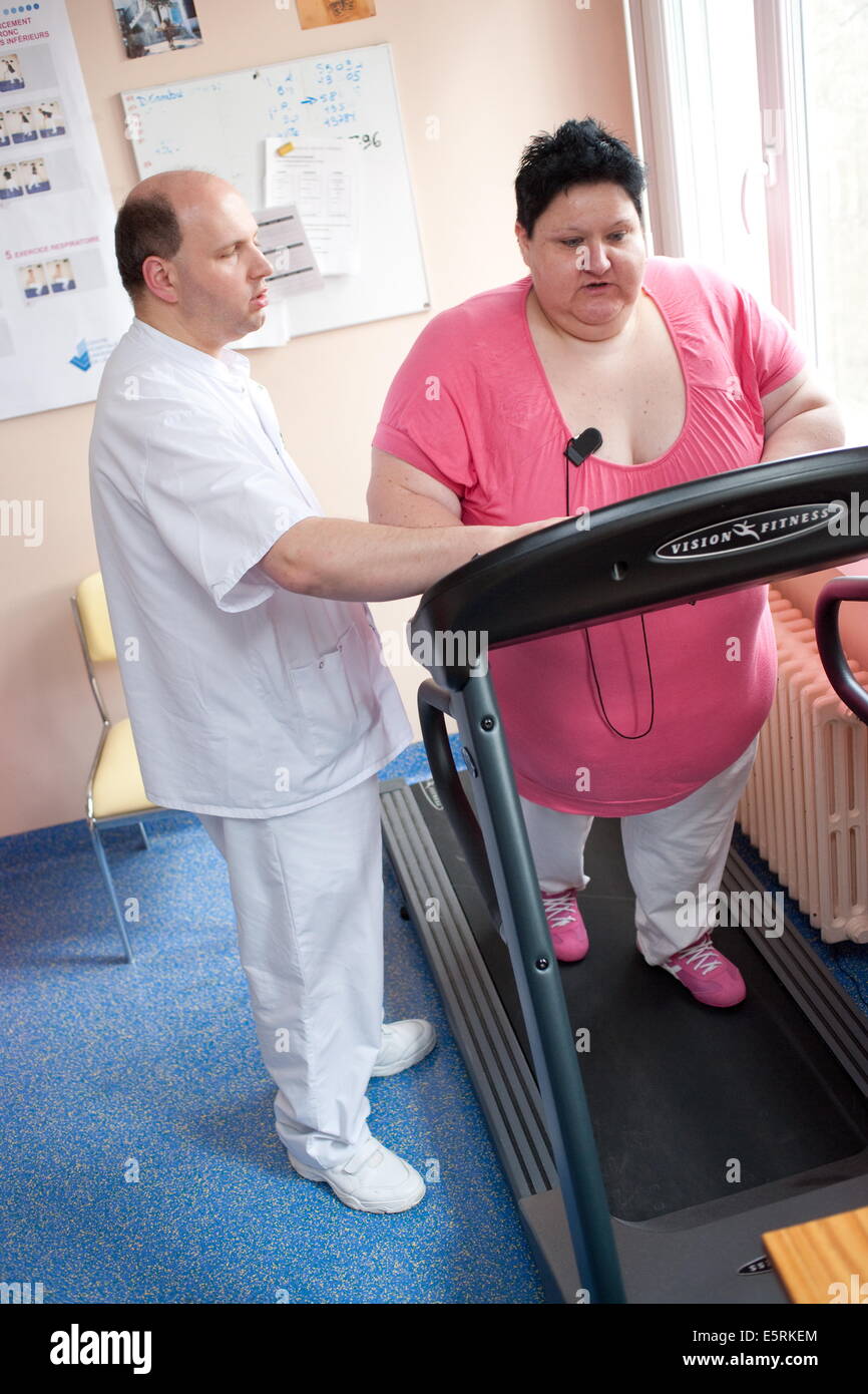 Female patient following an exercise program with a physiotherapist ...