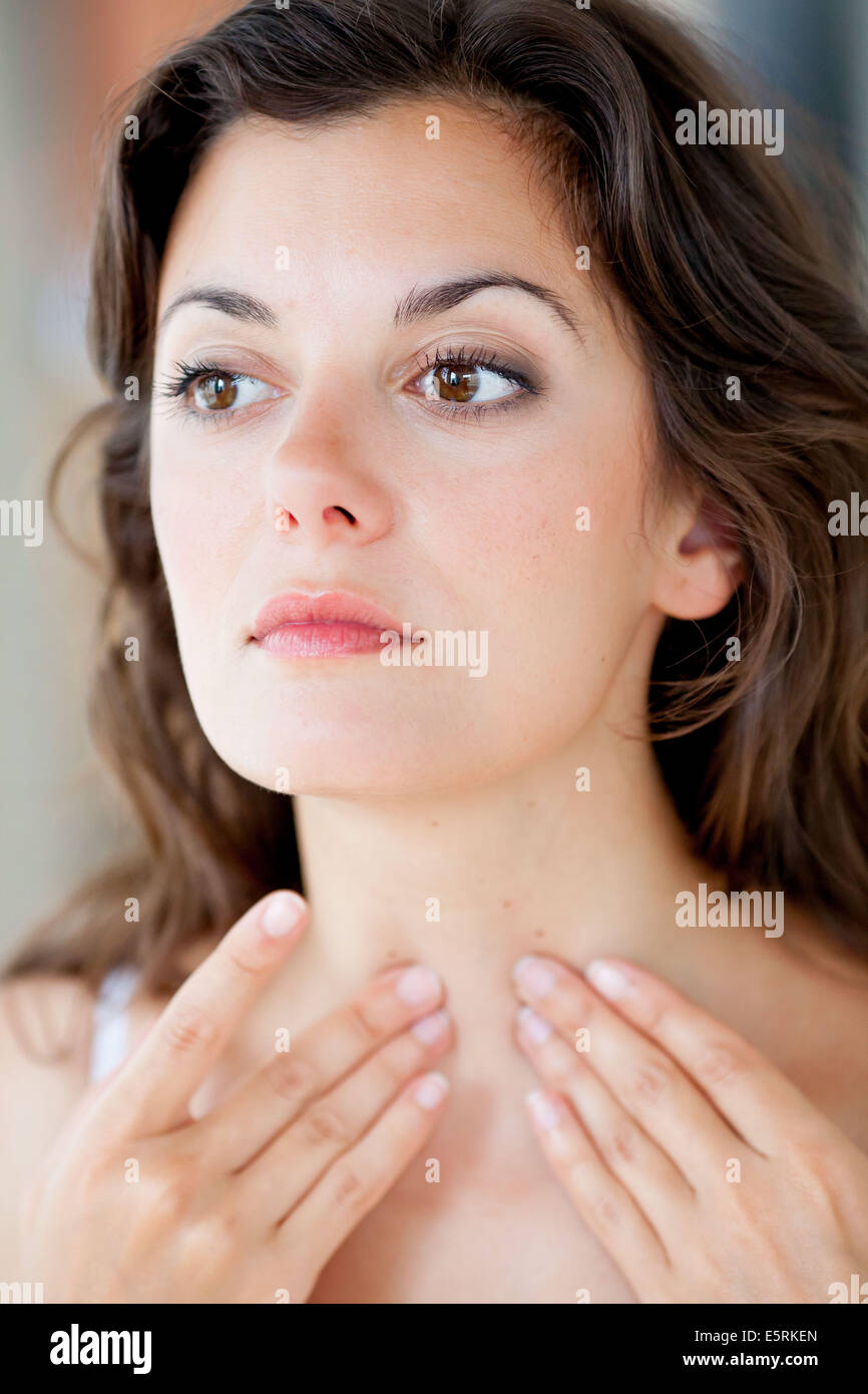 Woman self-examining her throat Stock Photo - Alamy