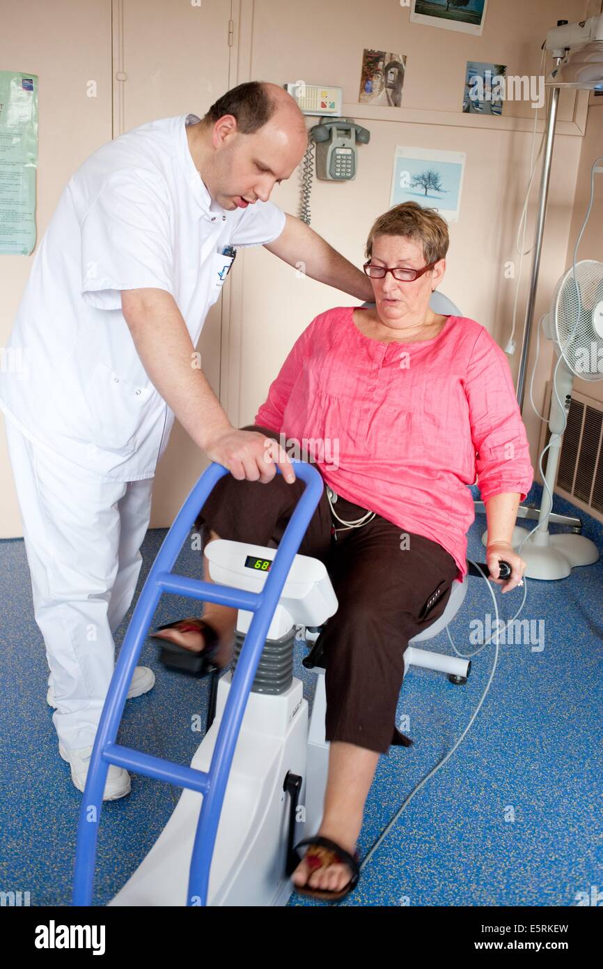 Female patient following an exercise program with a physiotherapist ...
