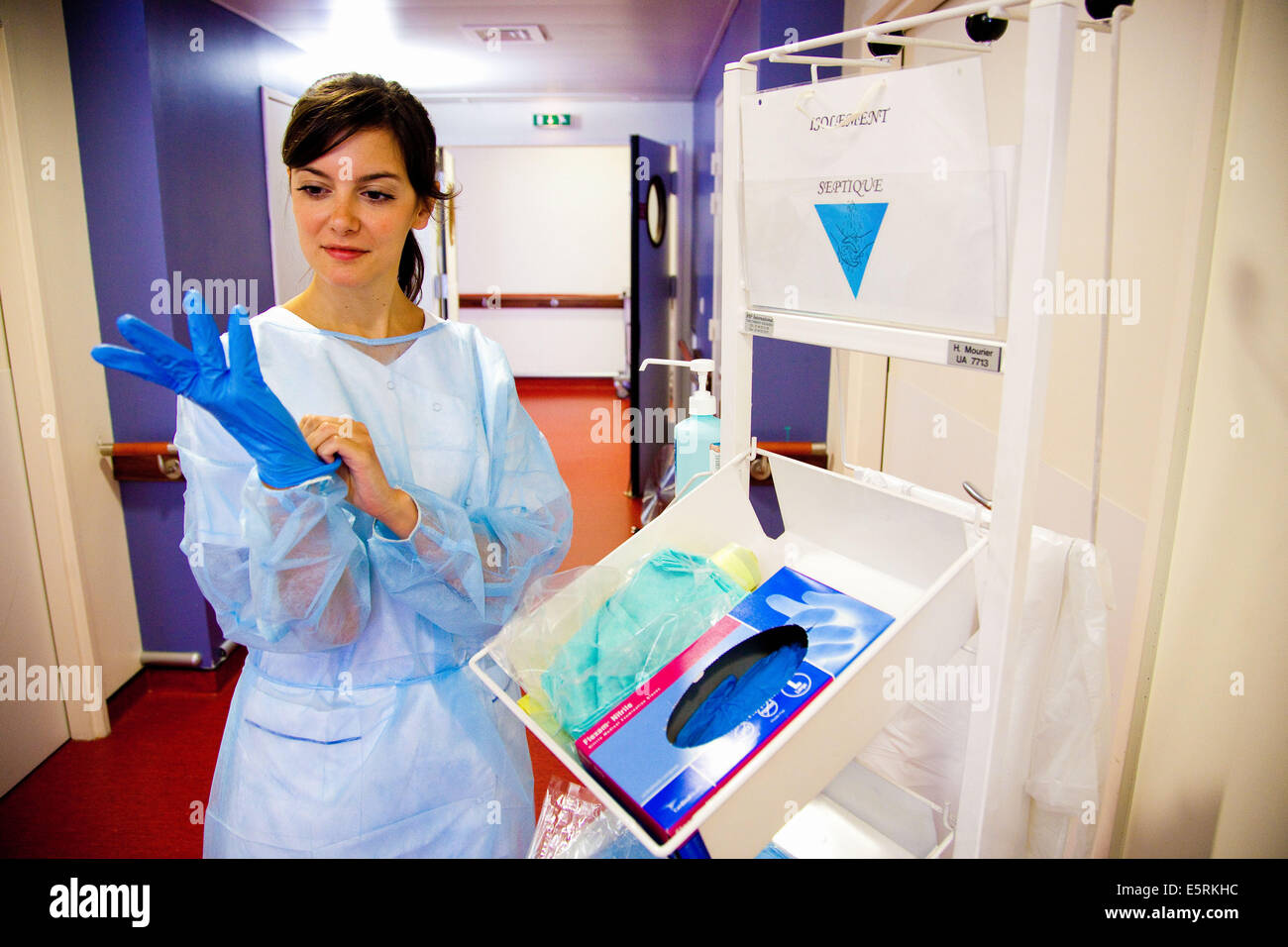Nurse getting dressed before surgery Stock Photo - Alamy