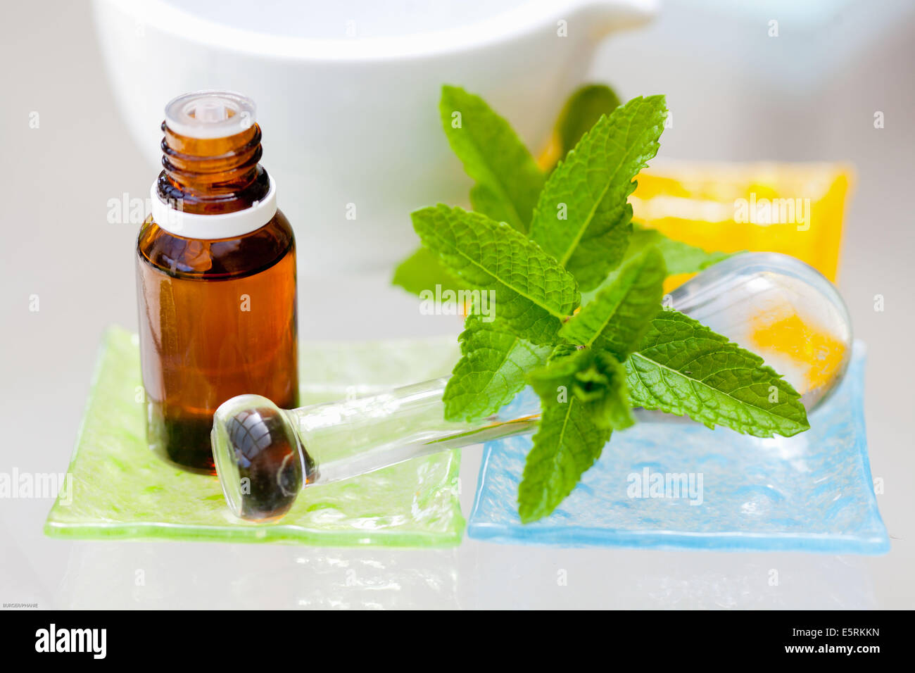 Bottle of mint essential oil Stock Photo - Alamy