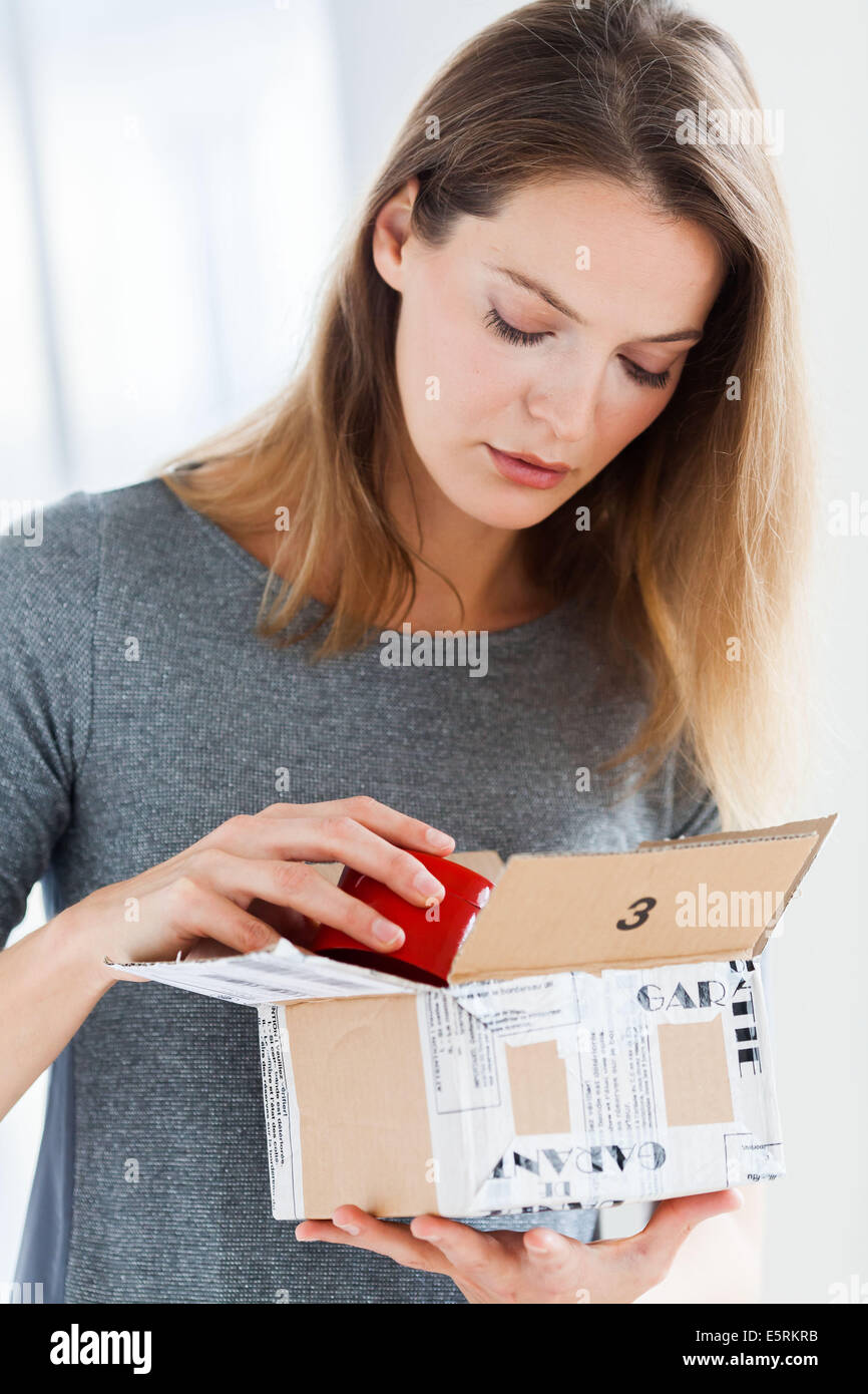 Woman receiving package Stock Photo - Alamy