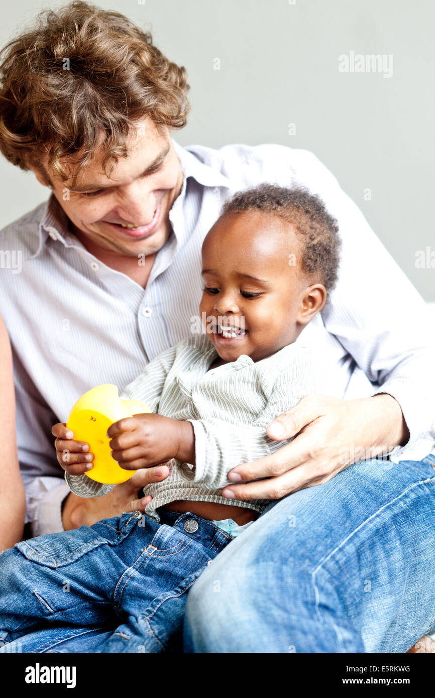 Adopted boy with his father Stock Photo - Alamy