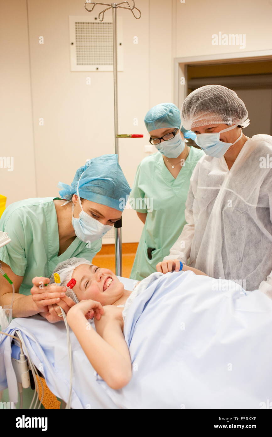 Mother accompany her child to the operating theatre, Nurse anesthetist ...