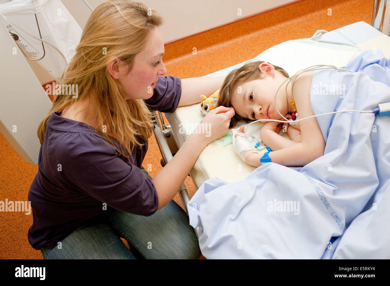 Mother accompany her child to the operating theatre, and is present in ...