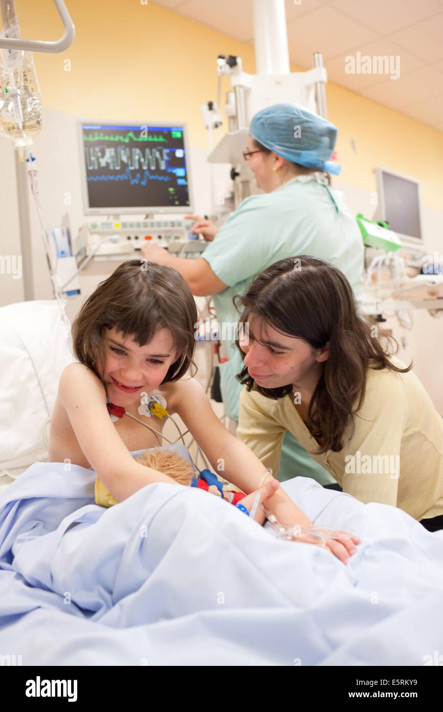 Mother accompany her child to the operating theatre, and is present in ...