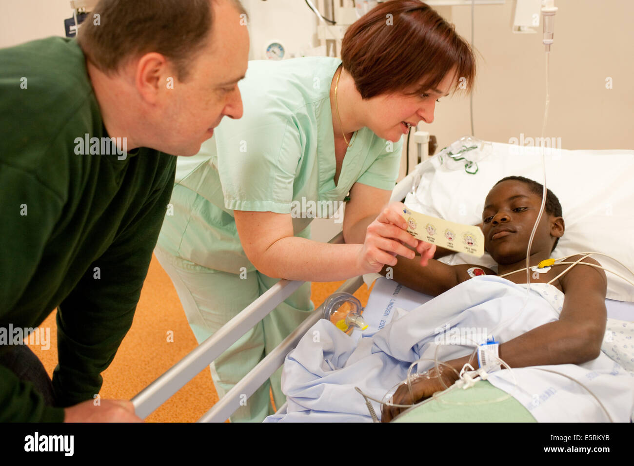Parents accompany their child to the operating theatre, and are present ...