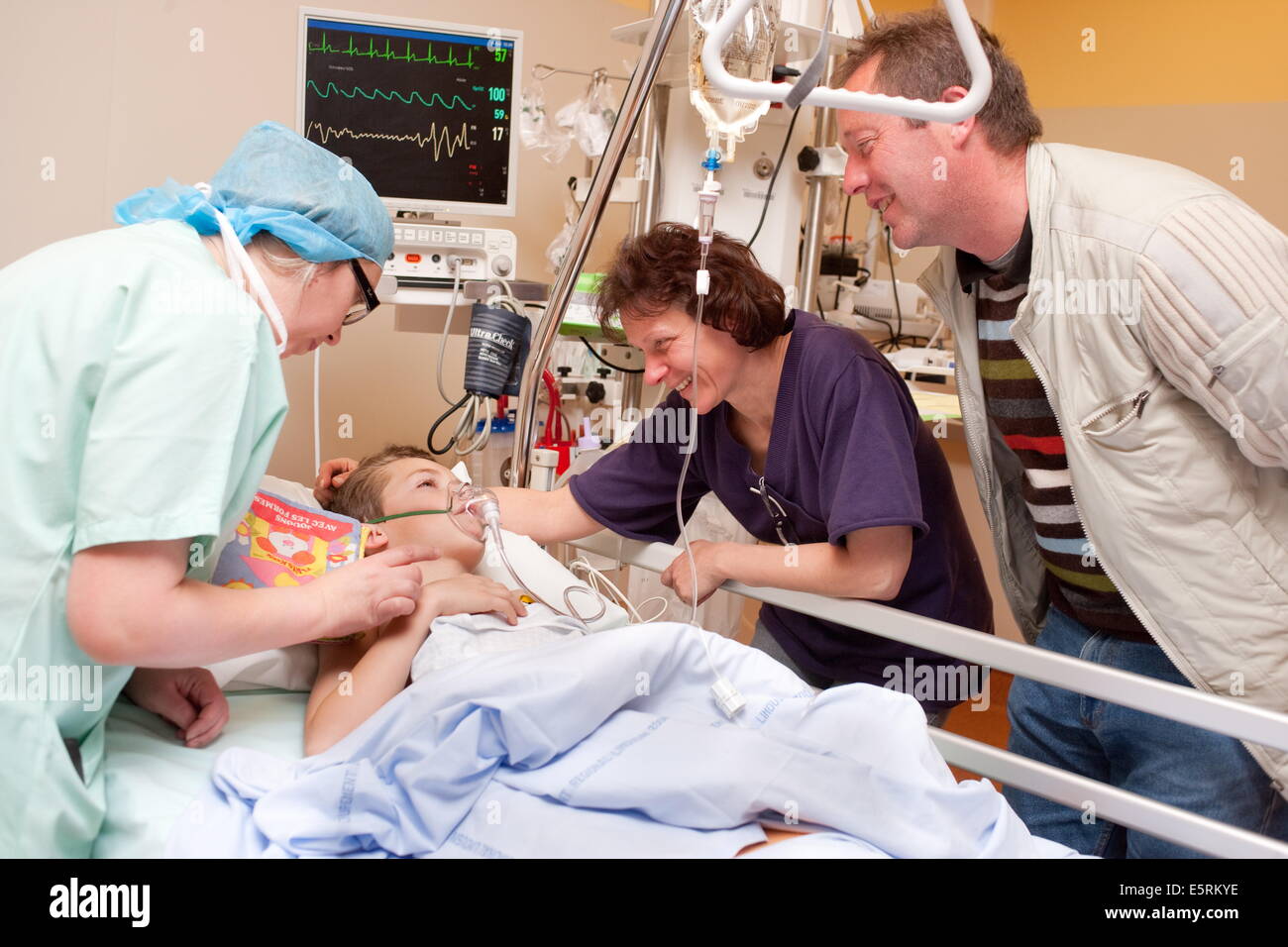 Parents accompany their child to the operating theatre, and are present ...