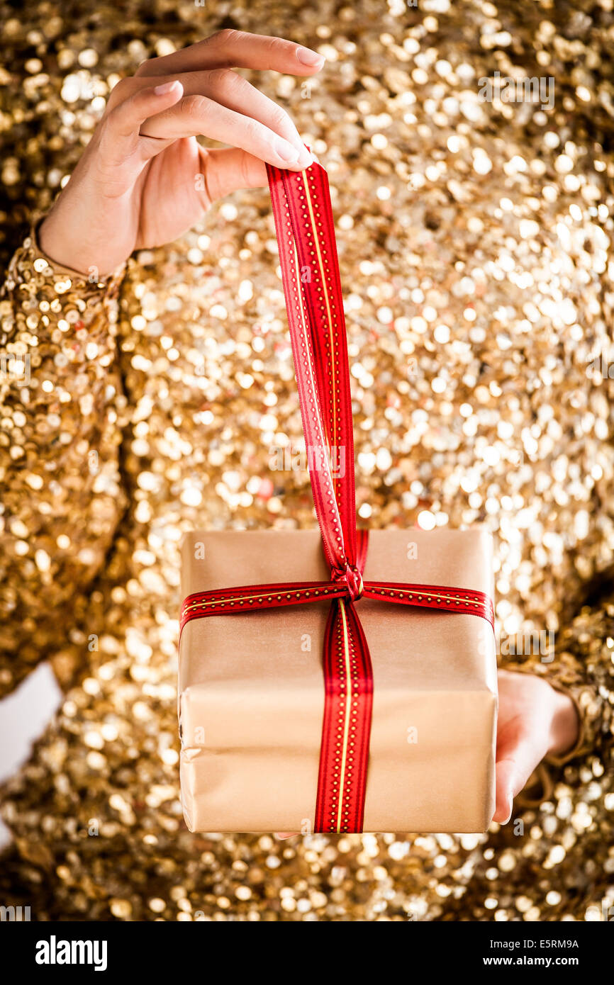 Woman opening a present Stock Photo - Alamy