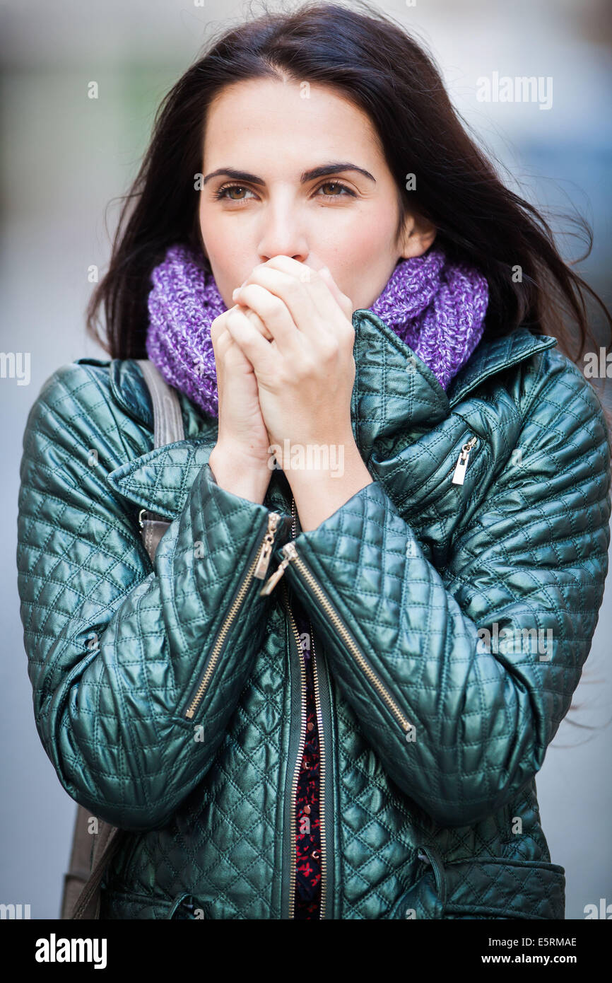 Woman blowing on his hands Stock Photo - Alamy