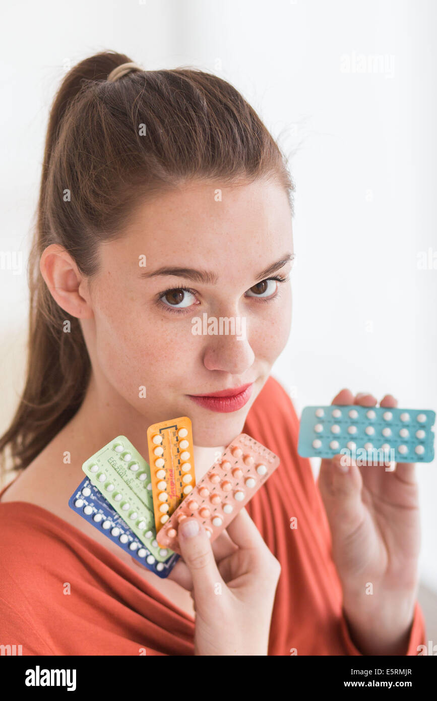 Woman holding contraceptive pills Stock Photo - Alamy