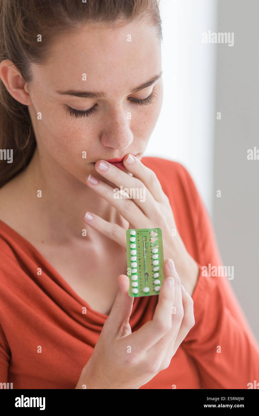 Woman holding contraceptive pills Stock Photo - Alamy