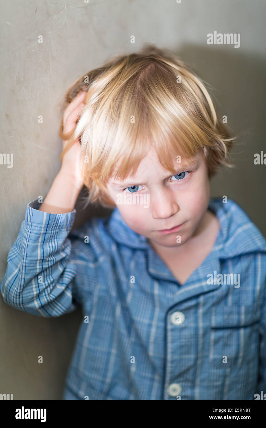 Boy scratching his head Stock Photo - Alamy