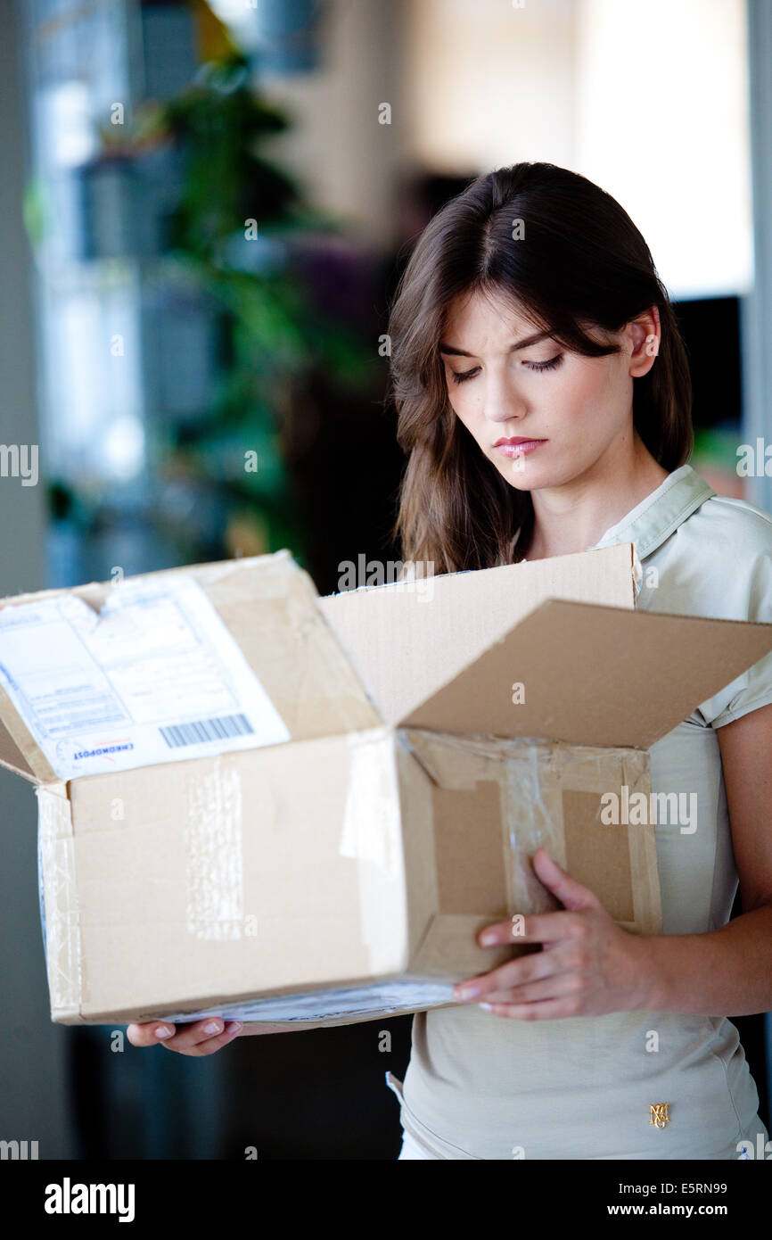 Woman receiving package Stock Photo - Alamy