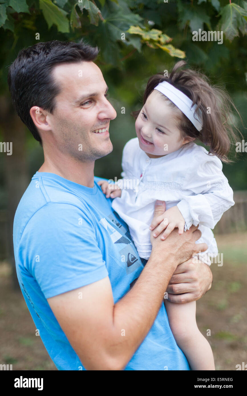 2 and a half year old girl with Down's syndrome with her father Stock ...
