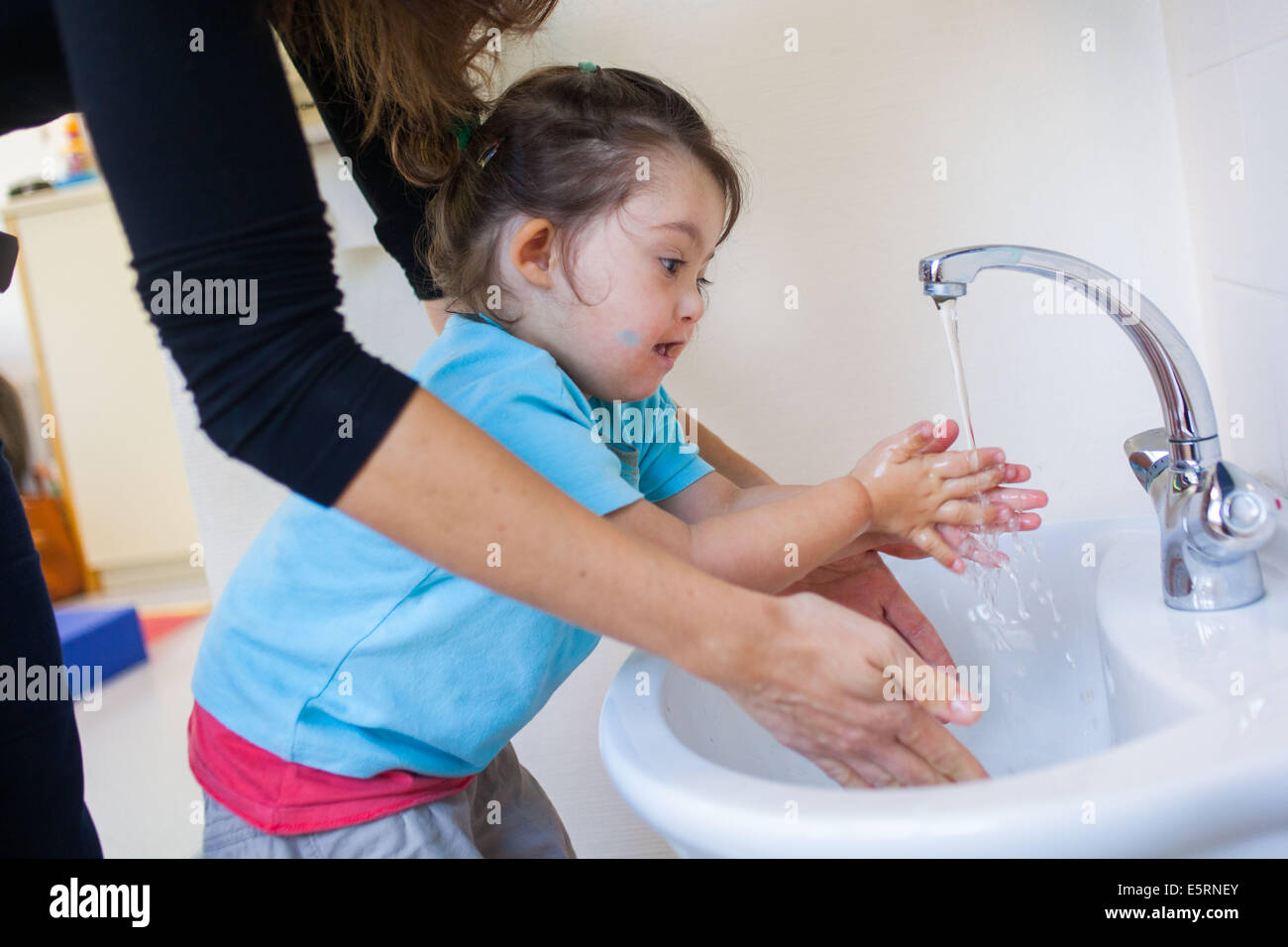 Half girl with down syndrome hi-res stock photography and images - Alamy
