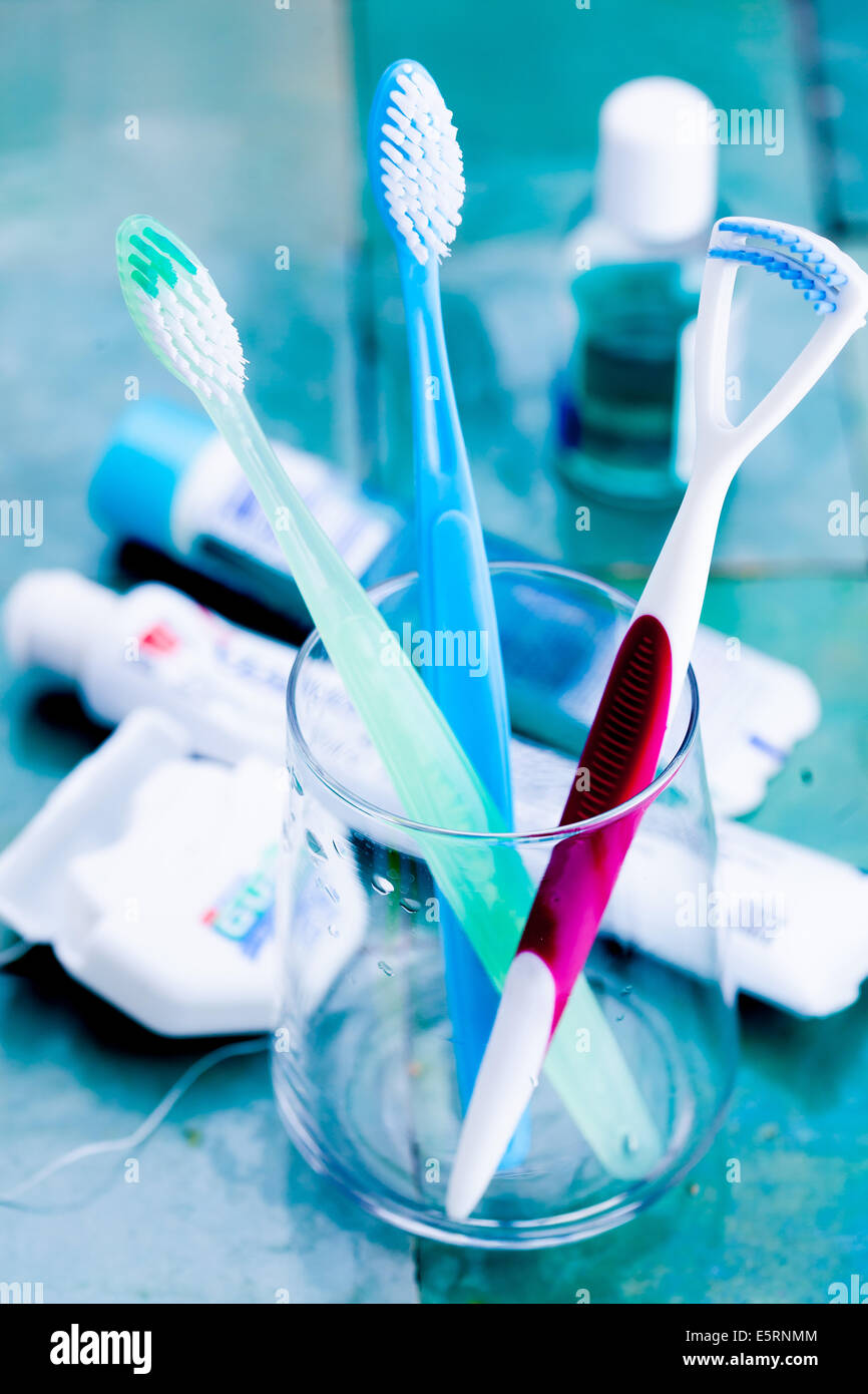 Dental floss, toothbrushes and toothpaste Stock Photo - Alamy