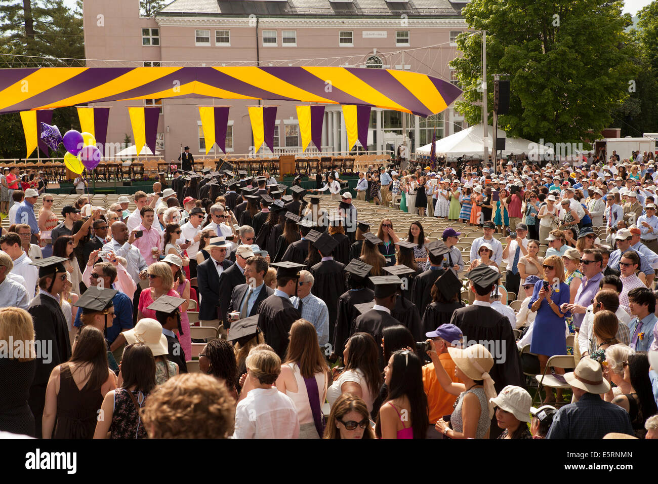 Graduating students parade into the seating area before their ...