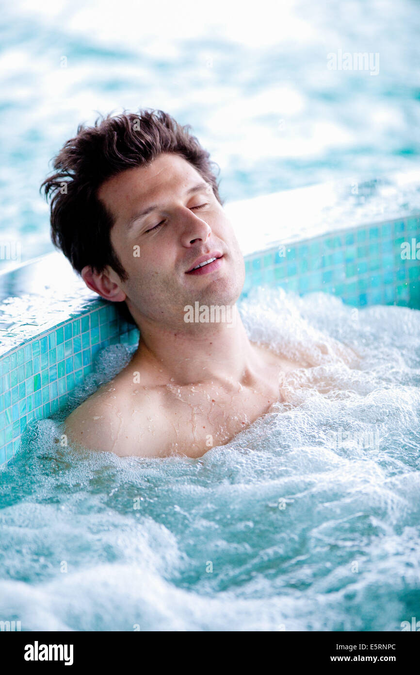 Man in spa pool Stock Photo - Alamy