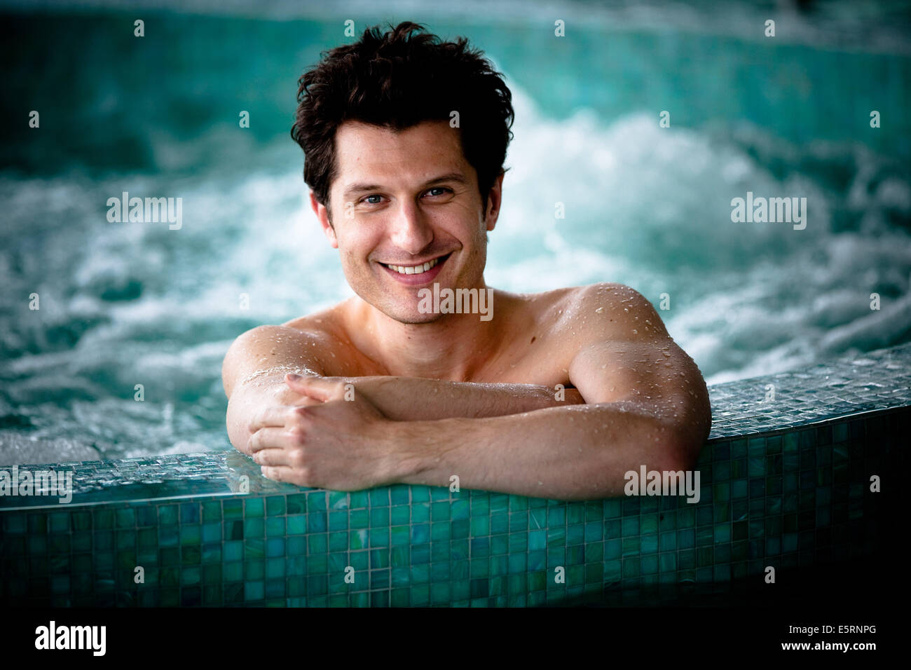 Man in spa pool Stock Photo - Alamy